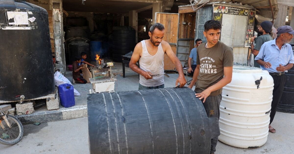 Gaza workshop repairs water tanks hit by bullets, bombs - AL-Monitor ...