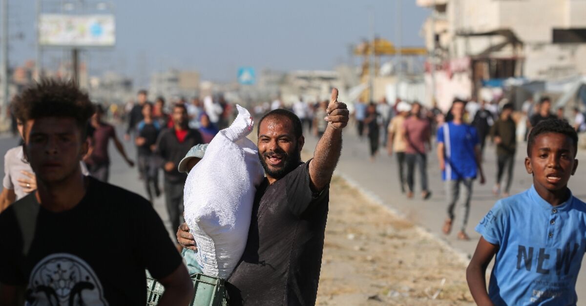 Thousands storm aid warehouse in Gaza as hunger crisis deepens - AL ...